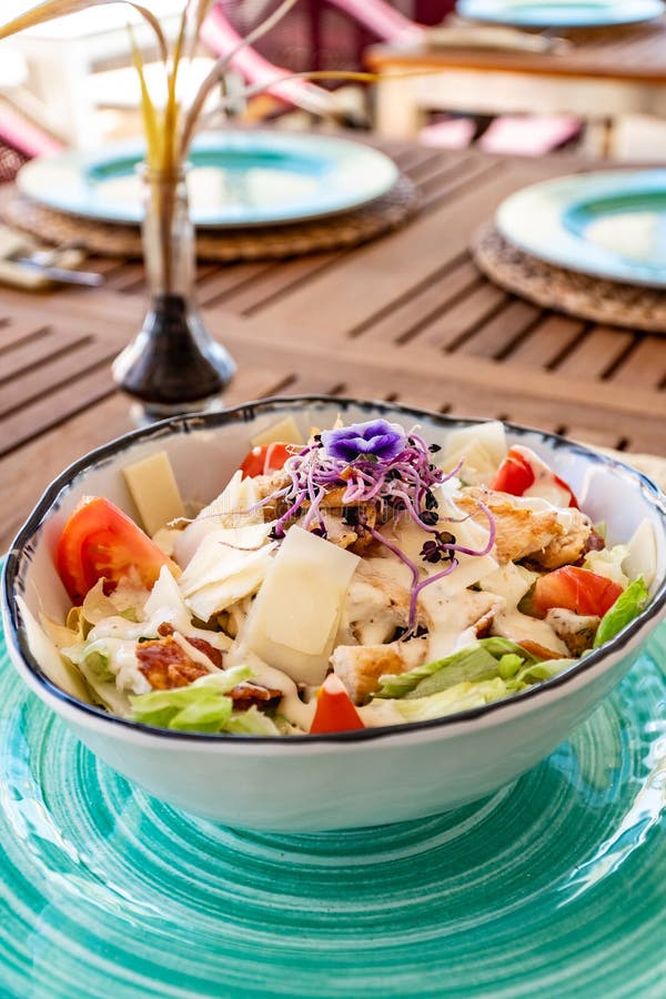 Portrait Image at a Mediterranean Restaurant of a Chicken Caesar Salad ...