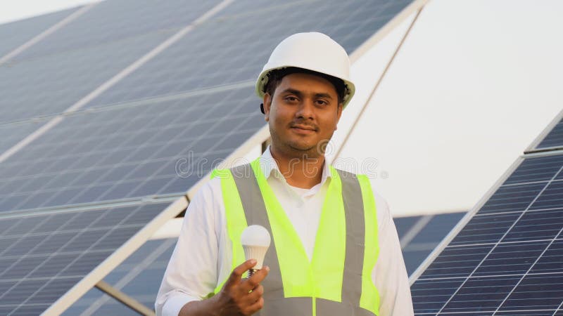 Portrait of Indian Engineer with Lamp on Solar Panels Station Stock ...