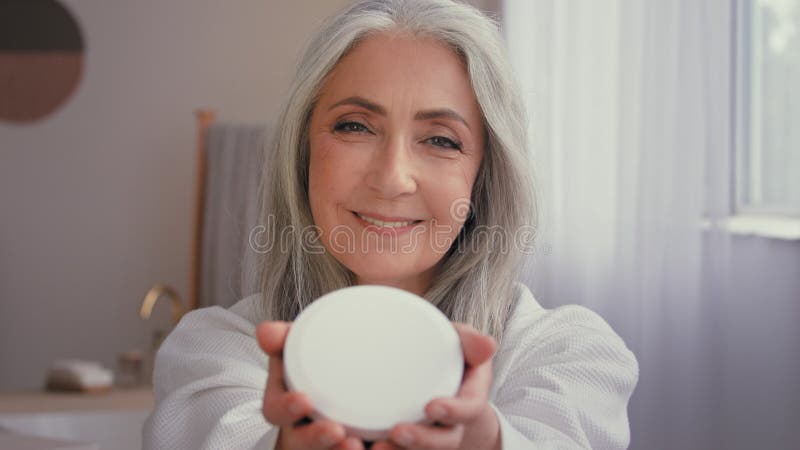 Caucasian 60s Senior Woman Old Lady Mature Female In Bathroom Talking Mobile Phone 50s Aged