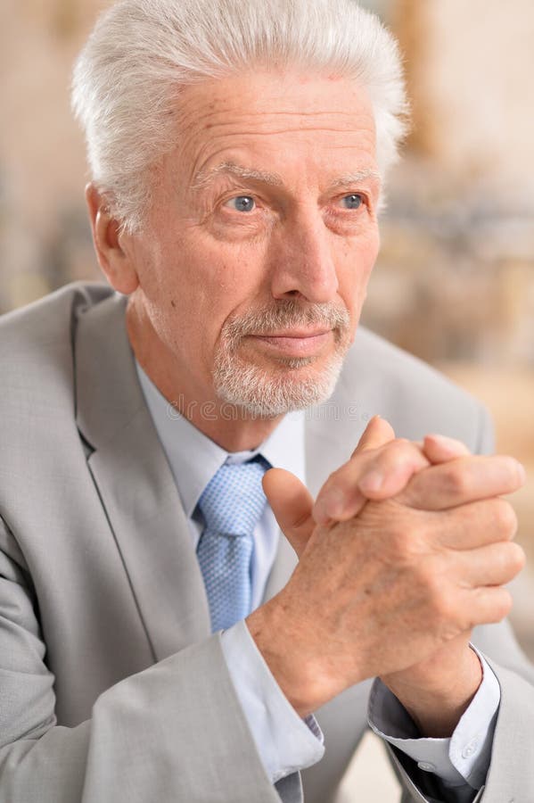 Portrait of Intelligent Elderly Business Man Thinking at Home Stock ...