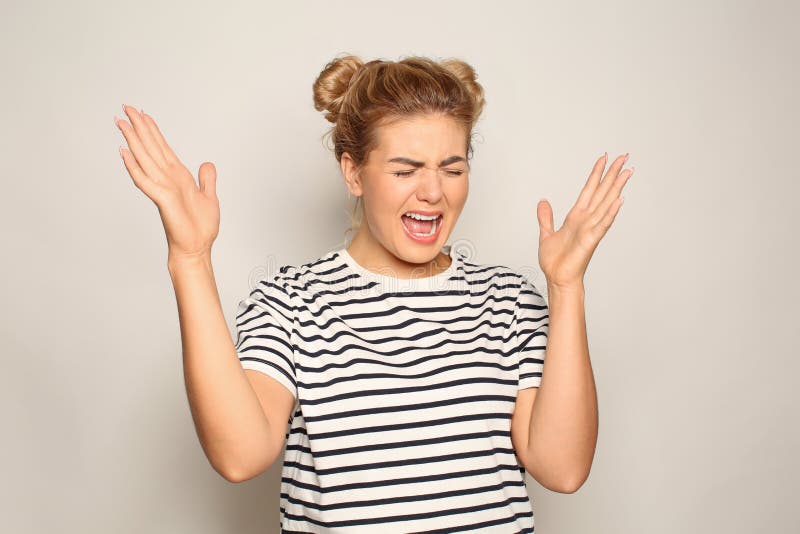 Portrait of Irritated Young Woman on Light Background Stock Image ... Portrait of Irritated Young Woman on Light Background Stock Image ...