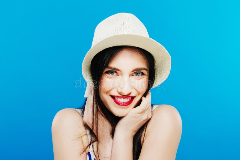 Portrait of Joyous Female Model in Summer Hat Posing in Studio on Blue ...