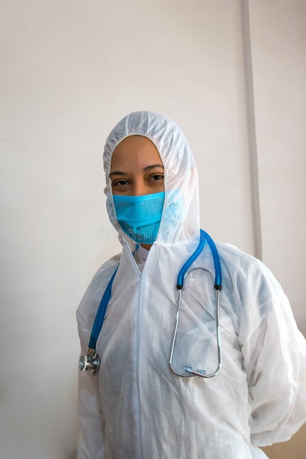 Portrait of a Latino Doctor in a PPE Protective Suit with a Mask Stock ...