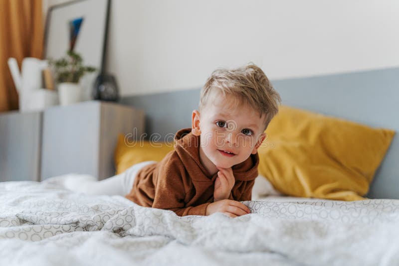 Portrait of Little Boy Lying in a Bed. Stock Image - Image of childhood ...