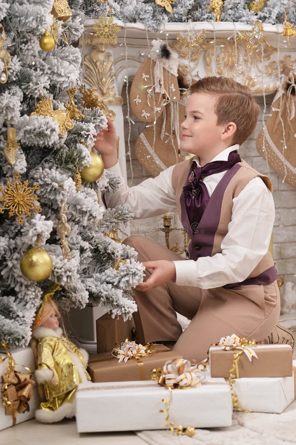 Little Boy with Gift Near Christmas Tree Stock Image - Image of child ...