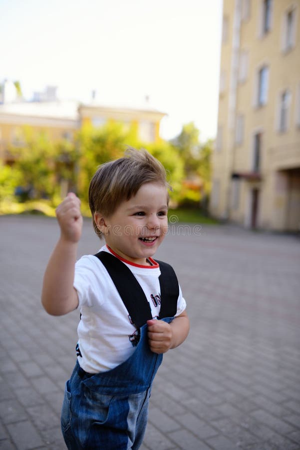 Portrait of Little Boy Running and Smiling Stock Image - Image of ...