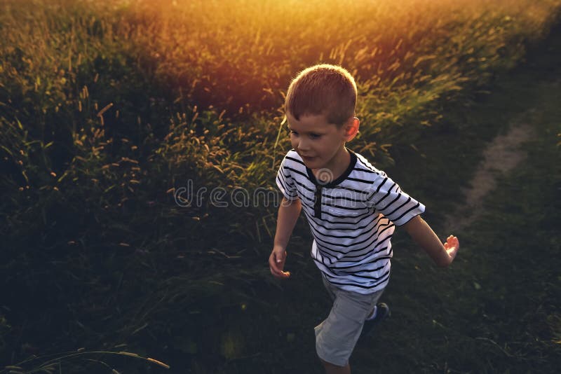 Portrait of a Little Boy Walk in Sunset on Summer Season Stock Image ...