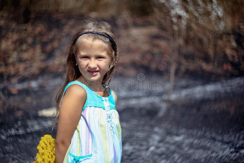Portrait of a Little Girl in the Forest after a Fire. Stock Photo ...