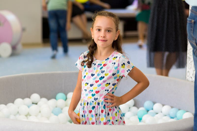 Portrait of a Little Girl Playing in the Pool with Plastic Balls Stock ...