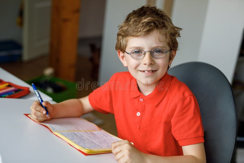 Portrait of Little Kid Boy with Glasses at Home Making Homework ...