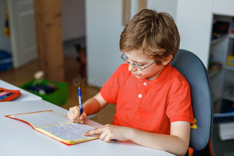Portrait of Little Kid Boy with Glasses at Home Making Homework ...