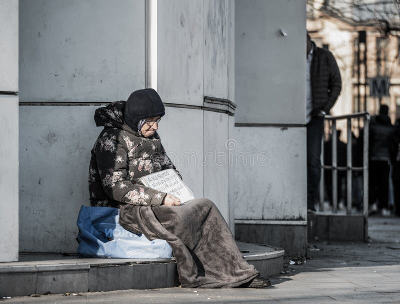 Portrait of a Lonely Old Senior Woman Sitting on the Sidewalk in the ... Portrait of a Lonely Old Senior Woman Sitting on the Sidewalk in the ...