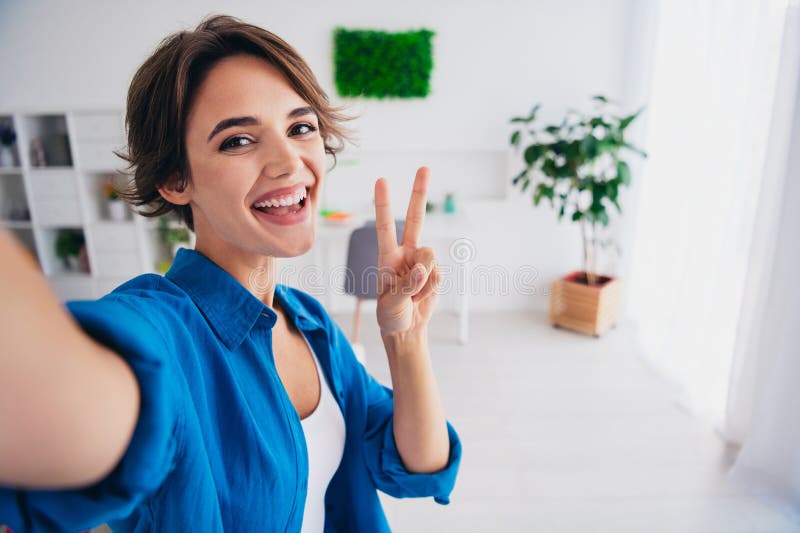 Portrait Of Lovely Cheerful Girl Toothy Smile Demonstrate V Sign Make