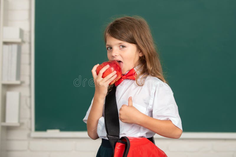 Portrait of Lovely Girl Wuth Red Apple in Classroom. Genius Child ... Portrait of Lovely Girl Wuth Red Apple in Classroom. Genius Child ...