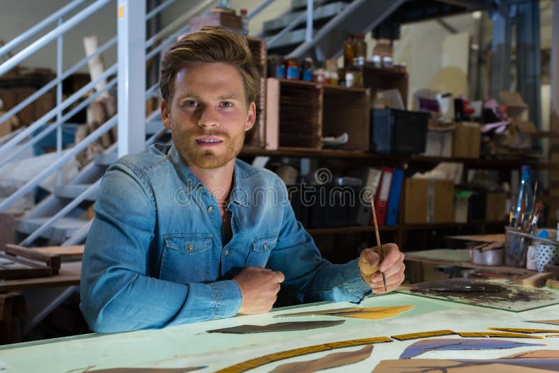 Portrait Male Artist Working on Illuminated Bench Stock Photo - Image ...