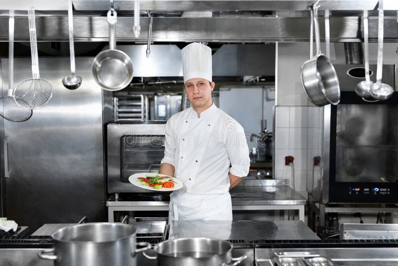 Portrait of a Male Chef Presenting Fish Dishes. Stock Photo - Image of ...