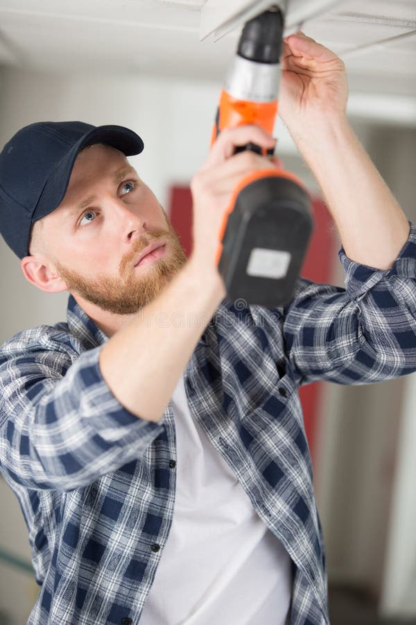 Portrait Male Construction Worker Using Cordless Drill Stock Photo ...