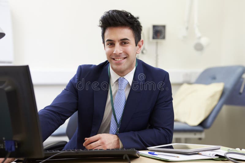 Portrait of Male Consultant Working at Desk Stock Photo - Image of name ...
