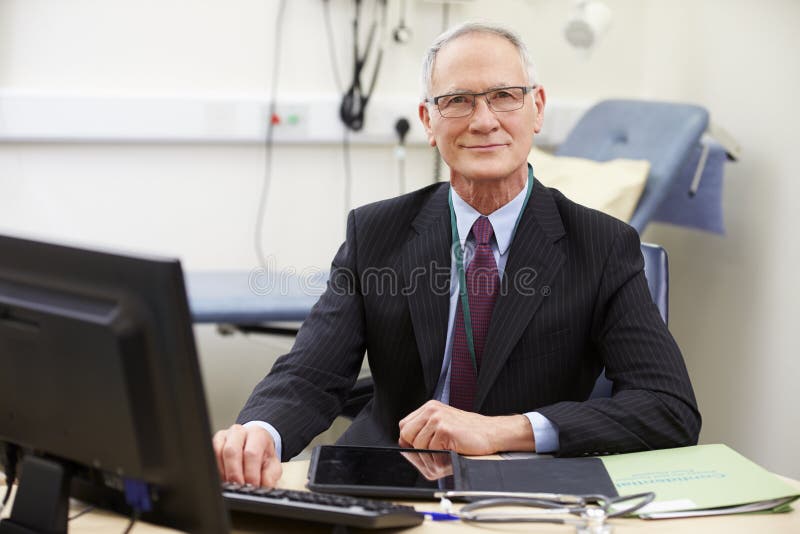 Portrait of Male Consultant Working at Desk Stock Image - Image of ...