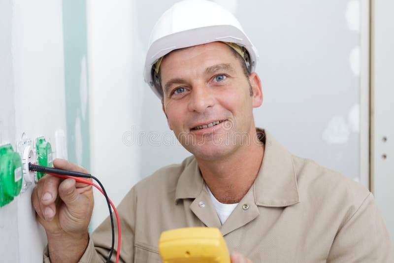 Portrait Male Electrician Using Multimeter To Test Socket Stock Photo ...