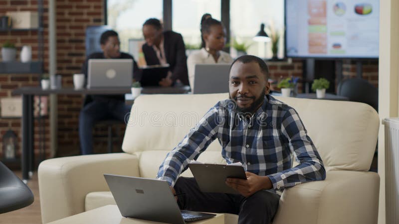 Portrait of Male Employee Analyzing Statistics on Laptop Stock Photo ...
