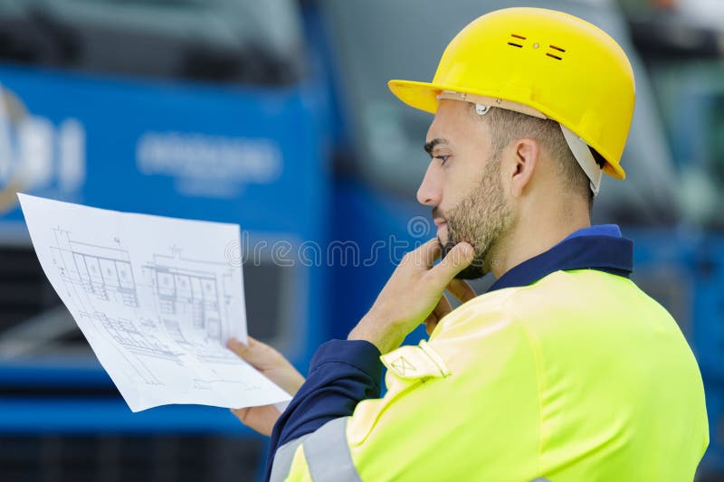 Portrait Male Engineer Studying Blueprint Stock Photo - Image of ...