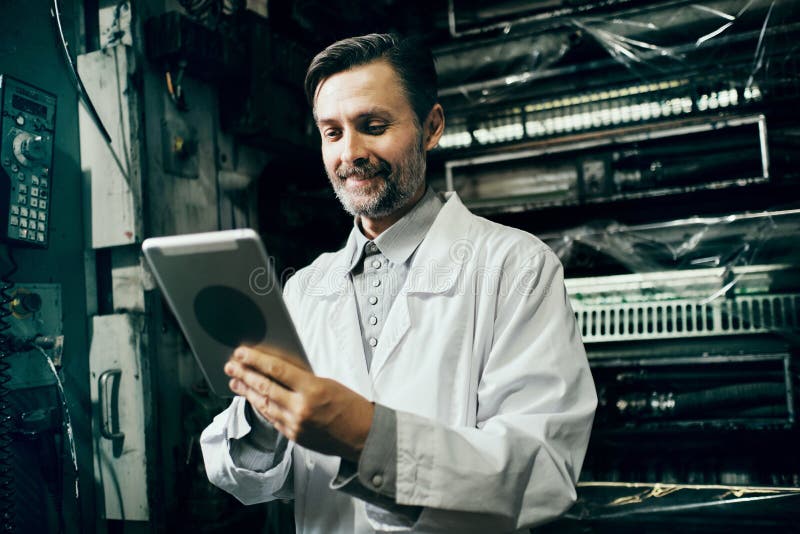 Engineer with Tablet Working at Polymer Factory Stock Photo - Image of ...