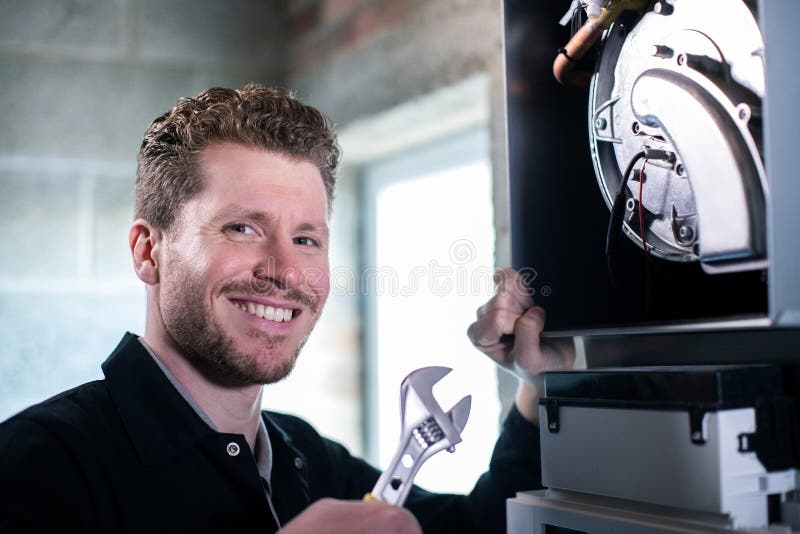 Heating Engineer Repairman In Boiler Room Stock Image - Image of ...