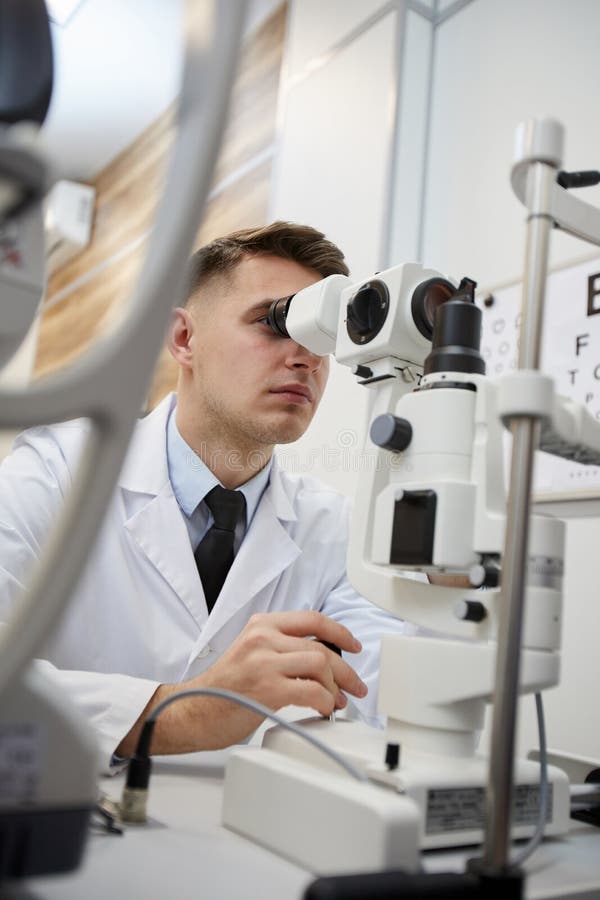 Optometrist Using Vision Test Machines Stock Image - Image of modern ...