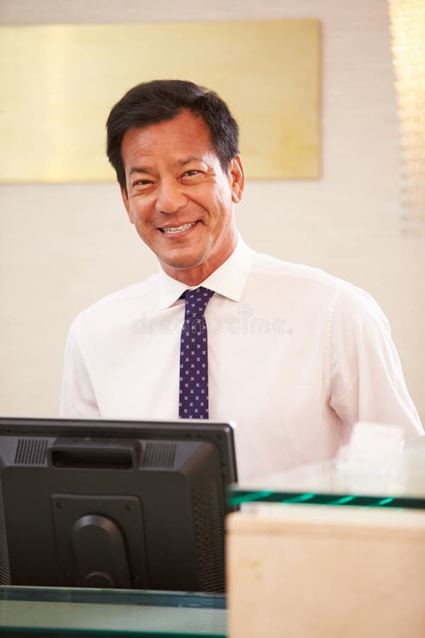 Portrait of Reception Staff at Hotel Front Desk Stock Image - Image of ...