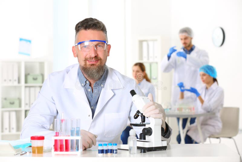 Portrait of Male Scientist at Table in Laboratory Stock Photo - Image ...