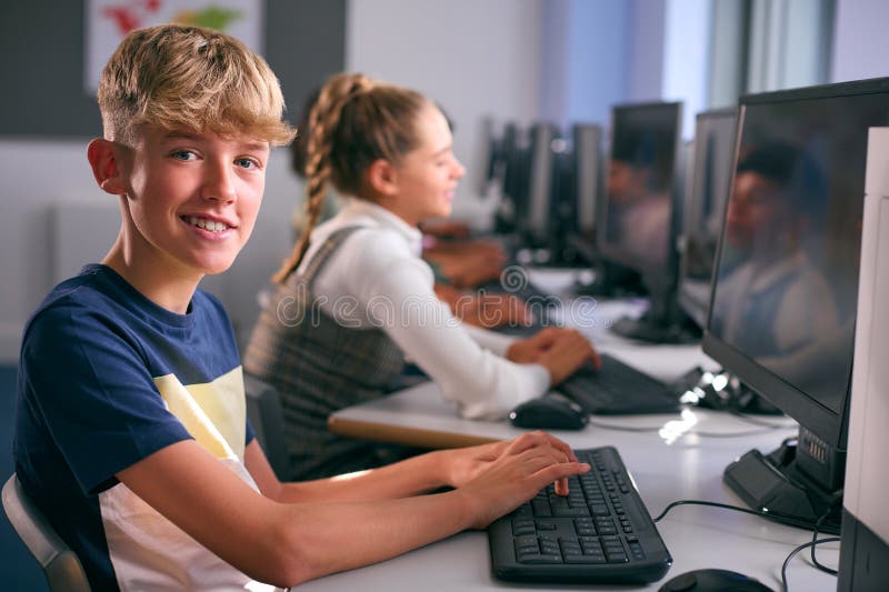 Portrait of Male Secondary or High School Student Sitting at Computer ...