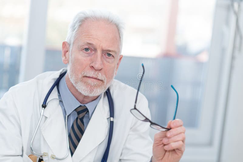 Portrait of Male Senior Doctor Stock Image - Image of looking ...
