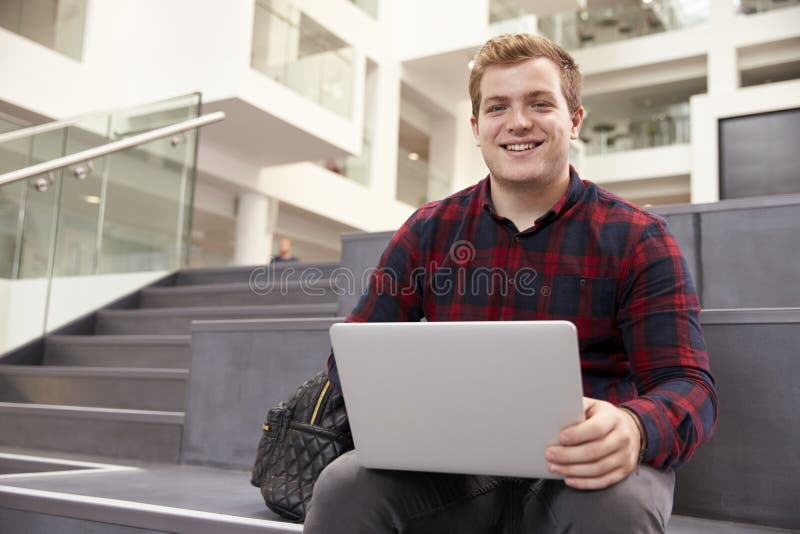 Portrait of Male University Student Using Laptop on Campus Stock Photo ...