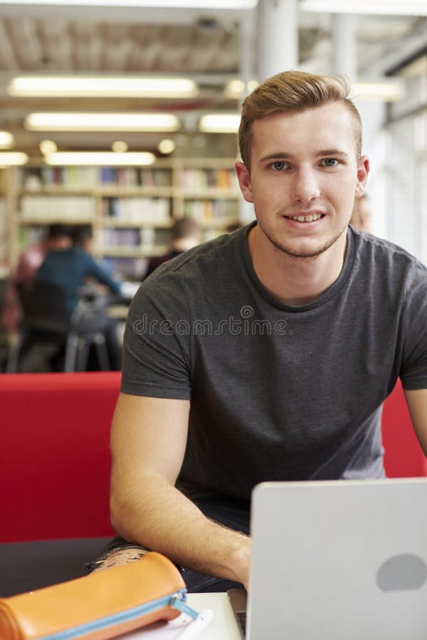 Portrait of Male University Student Working in Library Stock Photo ...