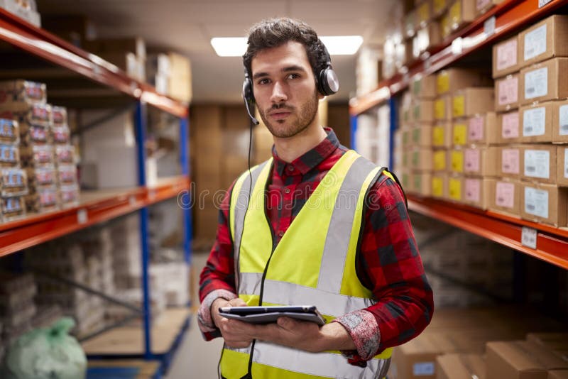 Portrait of Male Worker Wearing Headset in Logistics Distribution ...