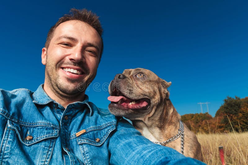 Portrait of Man and American Bully Smiling at the Camera Stock Image ...