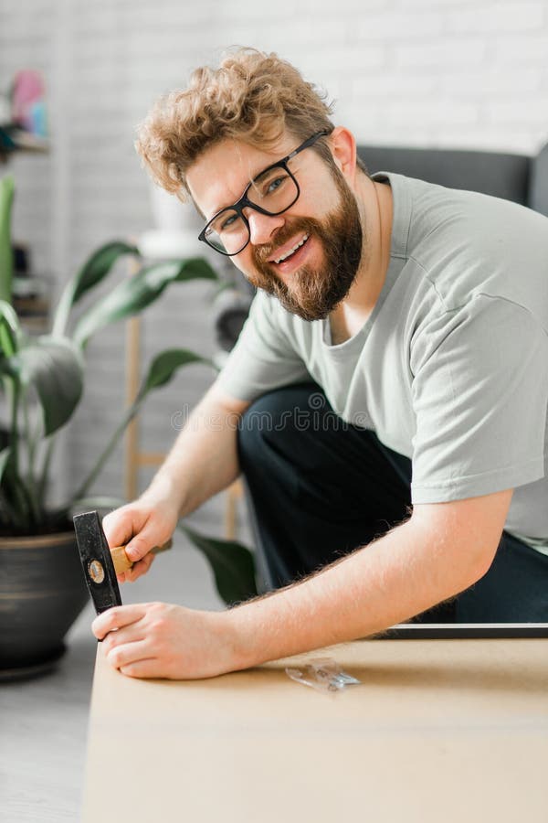 Portrait of Man Assembling Furniture. Do it Yourself Furniture Assembly ...