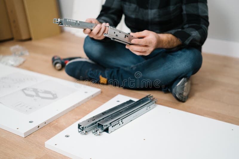 Portrait of Man Assembling Furniture. Do it Yourself Furniture Assembly ...