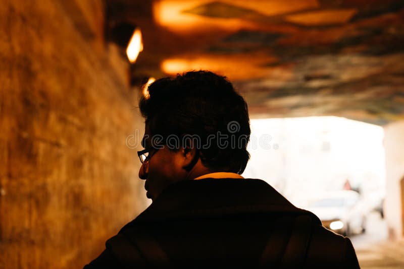 Portrait of a Man in the Backlight Looking Back in a Tunnel Stock Image ...