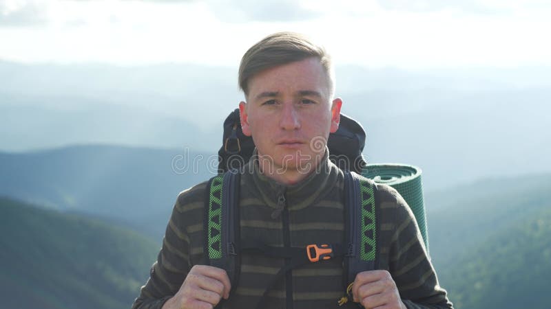 Portrait of a Man with a Backpack, Hiking, Looking into the Frame Stock ...