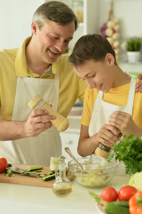Portrait of Man and Boy Cooking in Kitchen Stock Image - Image of smile ...