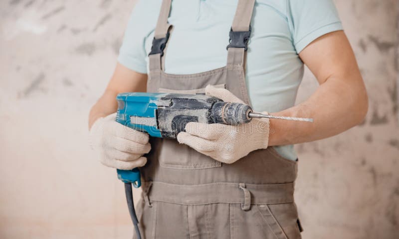 Portrait Man Builder Repairer in Protective Glasses, Hard Hat, Overalls ... Portrait Man Builder Repairer in Protective Glasses, Hard Hat, Overalls ...