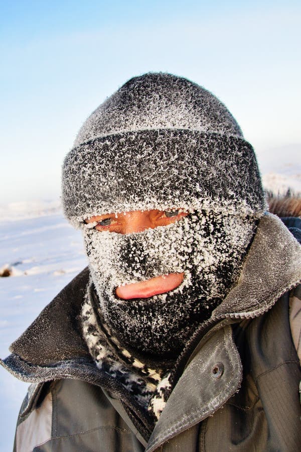 Portrait of a Man in a Cap and a Ski Mask. Stock Photo - Image of ...
