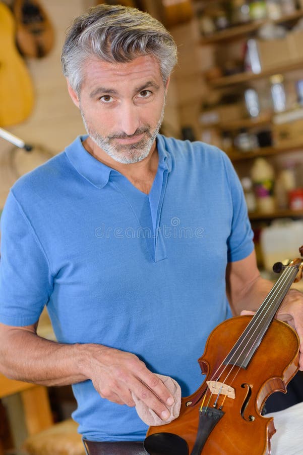 Portrait Man Cleaning Violin Stock Photo - Image of expressions, person ...