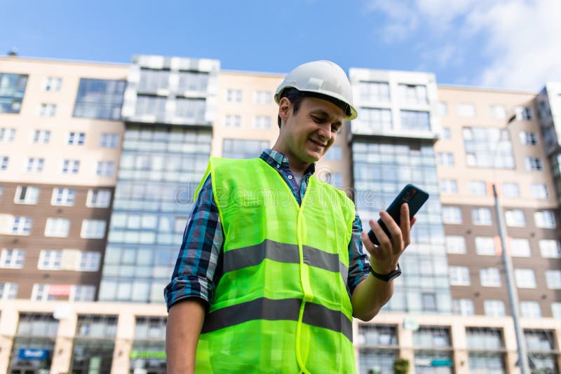 Portrait of a Man Construction Builder in Yellow Helmet Use Phone in ...