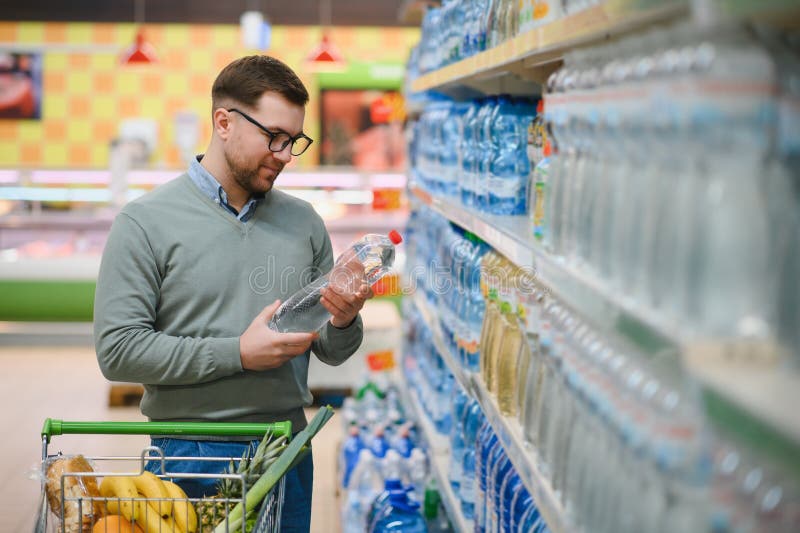 Portrait of Man Customer Who is Standing with Drinks in Supermarket ...