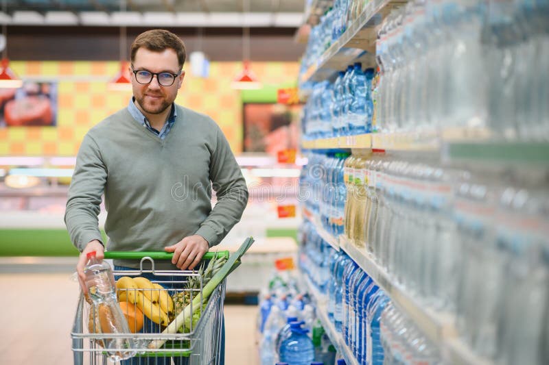 Portrait of Man Customer Who is Standing with Drinks in Supermarket ...