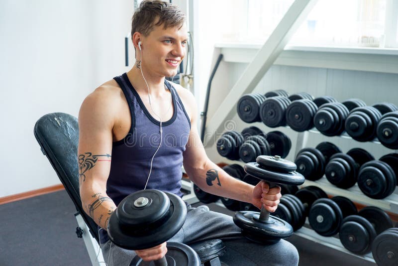 Man at a gym stock photo. Image of health, female, dumbbell - 102430424