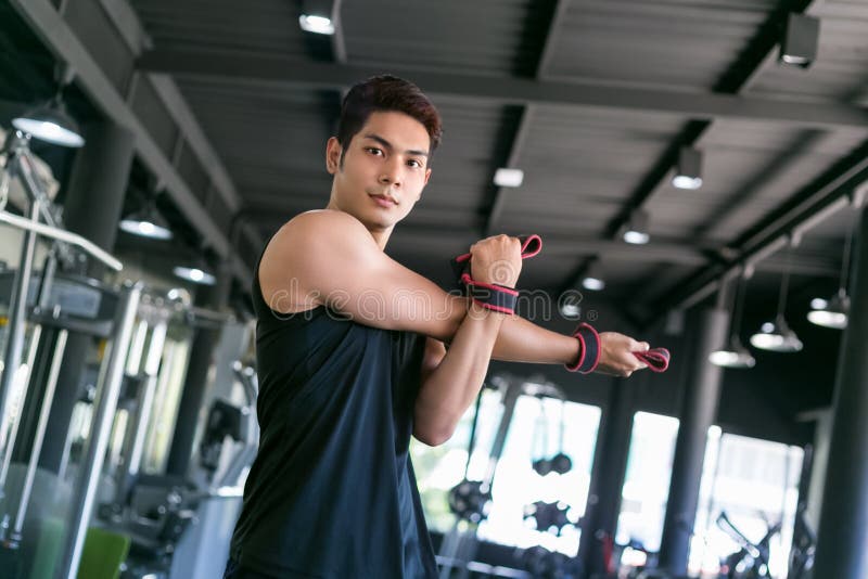 Portrait of a Man Doing Stretching Exercises at Gym. Stock Photo ...